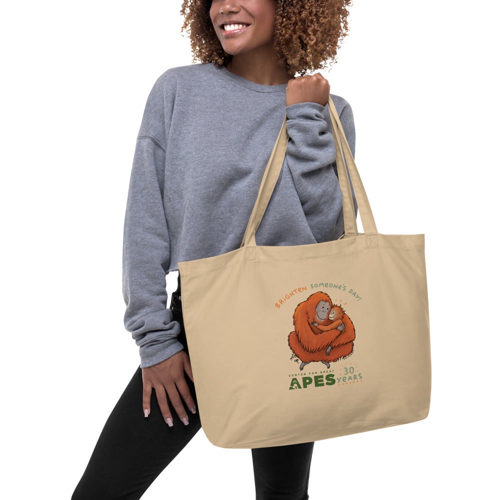 Tote bag featuring art by Sophie Corrigan and the CGA logo | Center for Great Apes SHOP